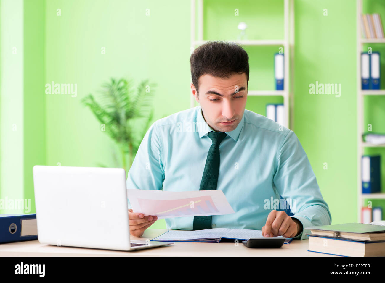 Male financial manager working in the office Stock Photo - Alamy