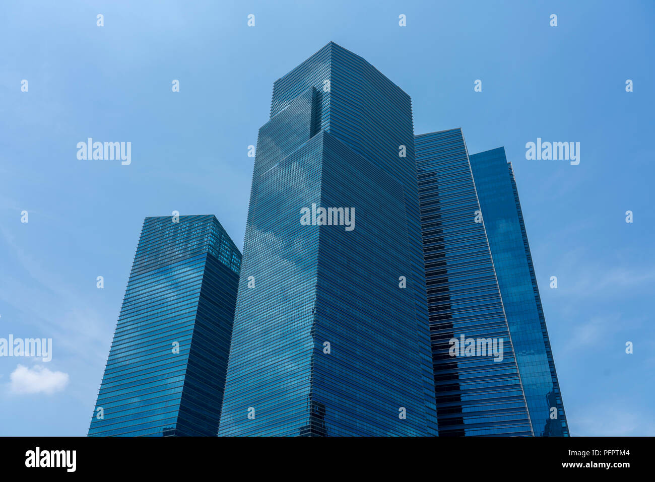 Singapore - August 11, 2018: Tall blue buildings against blue sky Stock ...