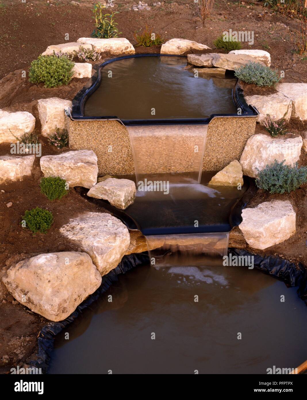 Watercourse with plants and rocks Stock Photo - Alamy