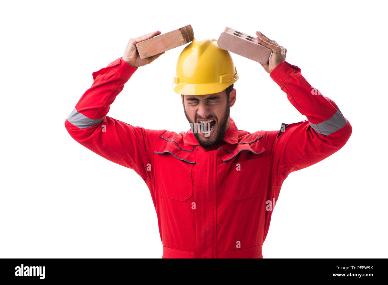 Angry builder breaking bricks isolated on white Stock Photo - Alamy