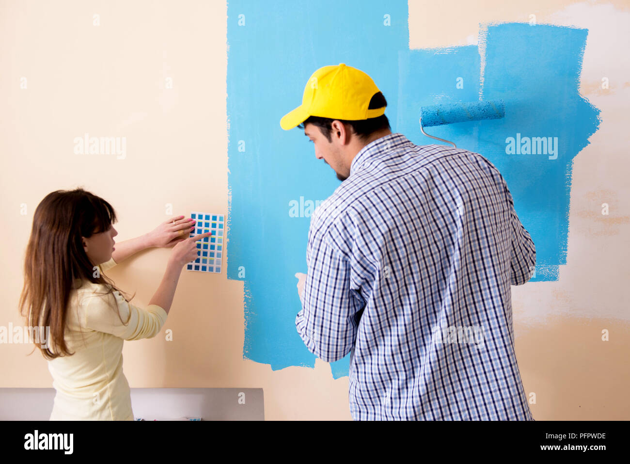 Husband and wife doing renovation at home Stock Photo - Alamy