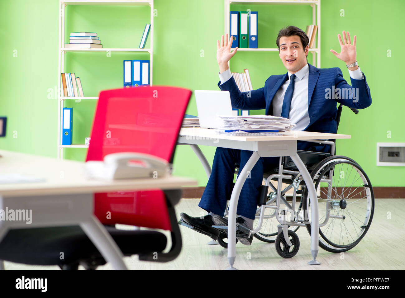 Disabled businessman working in the office Stock Photo - Alamy