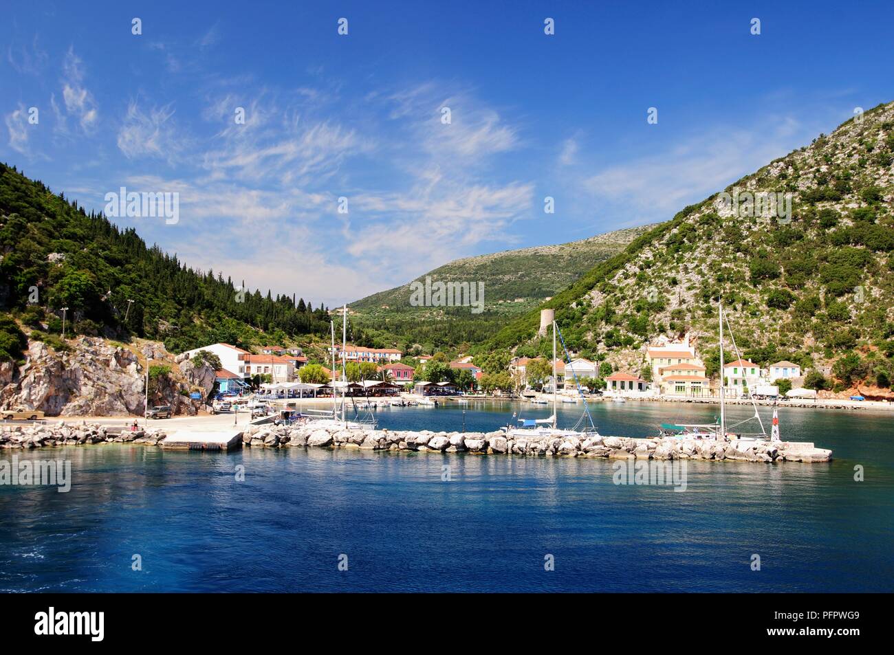 Greece, Greek Islands, Frikes, stone jetty on waterfront Stock Photo ...