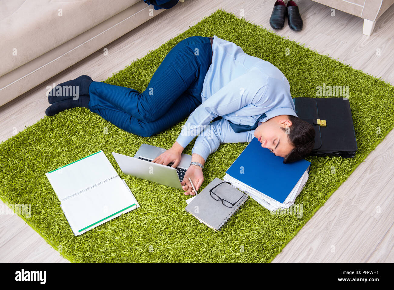 Tired and exhausted businessman relaxing after hard day Stock Photo - Alamy