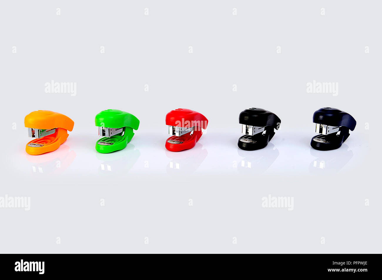 Staplers of different colors isolated on a white background Stock Photo ...