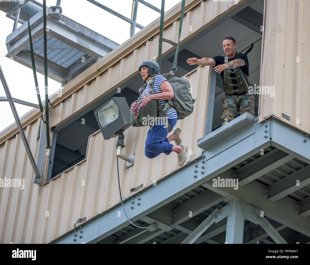 A former U.S. service woman jumps out of a 34 foot Tower during All ...