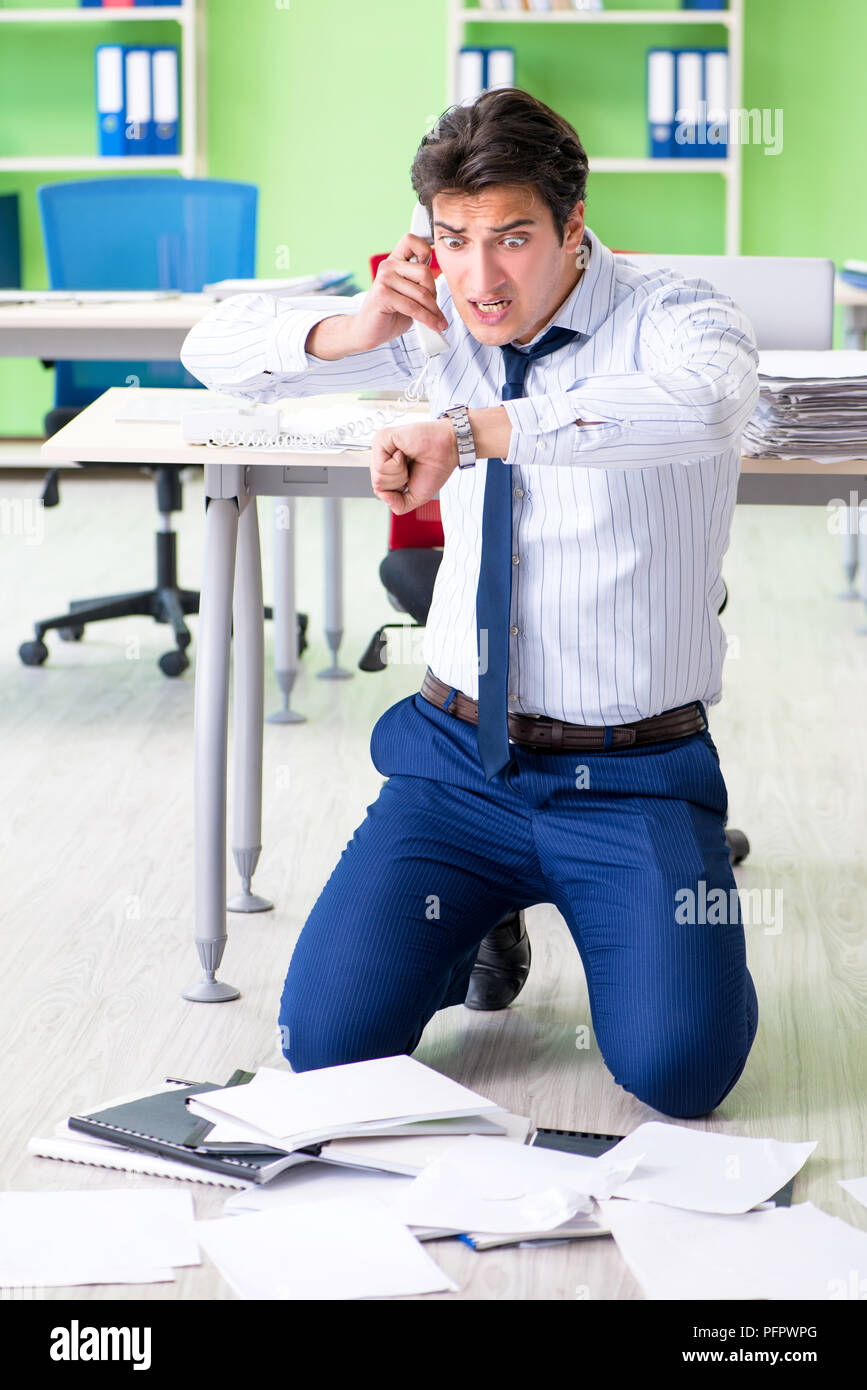 Frustrated businessman stressed from excessive work Stock Photo - Alamy