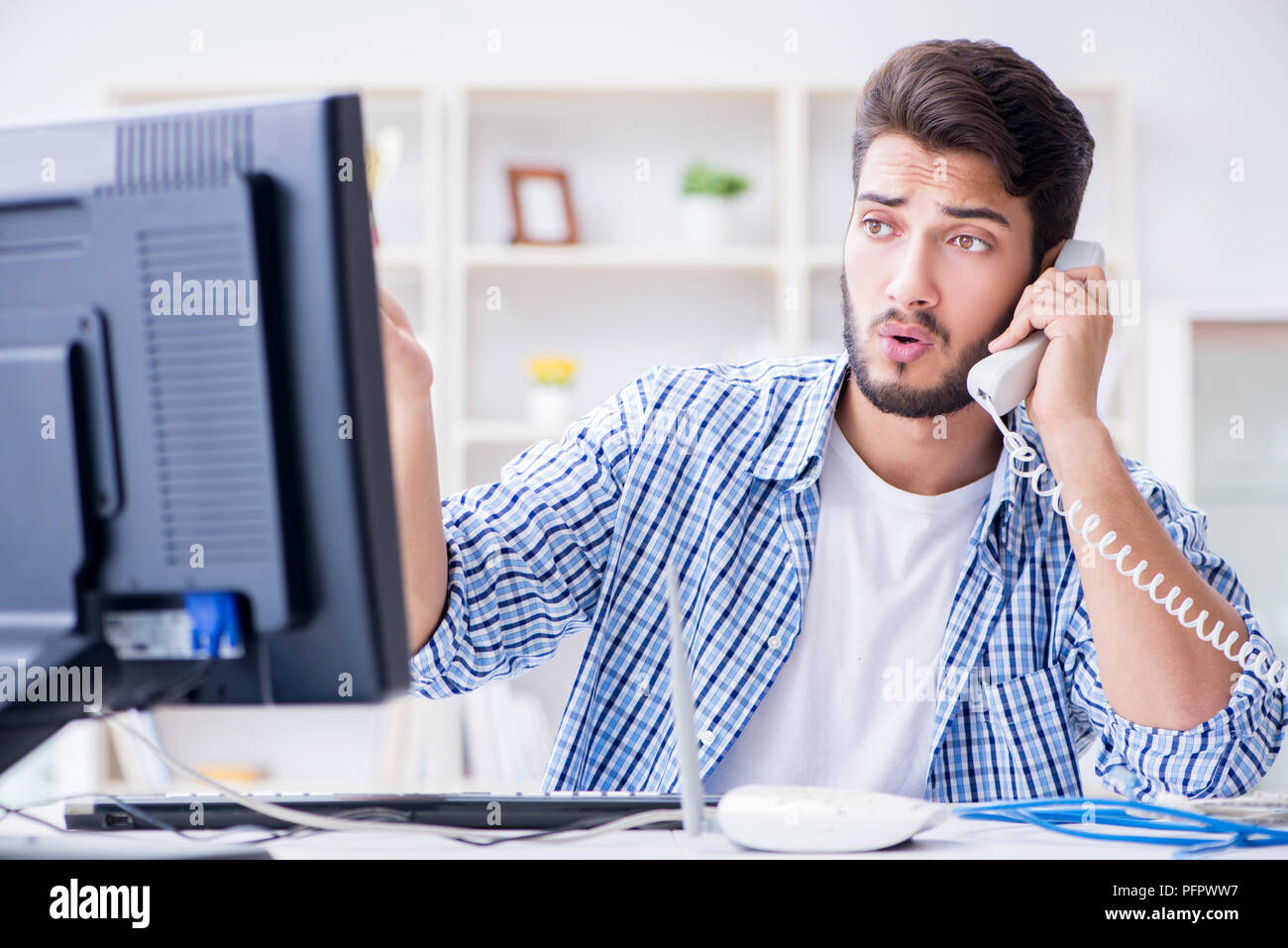 Frustrated young man due to weak internet reception Stock Photo - Alamy