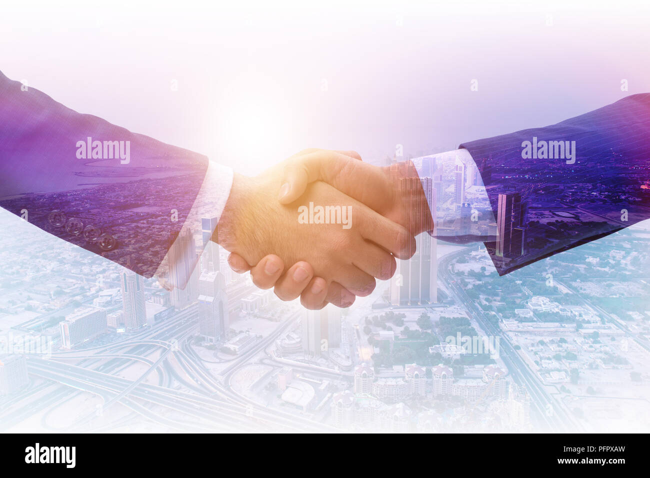 Concept of cooperation with handshake Stock Photo - Alamy