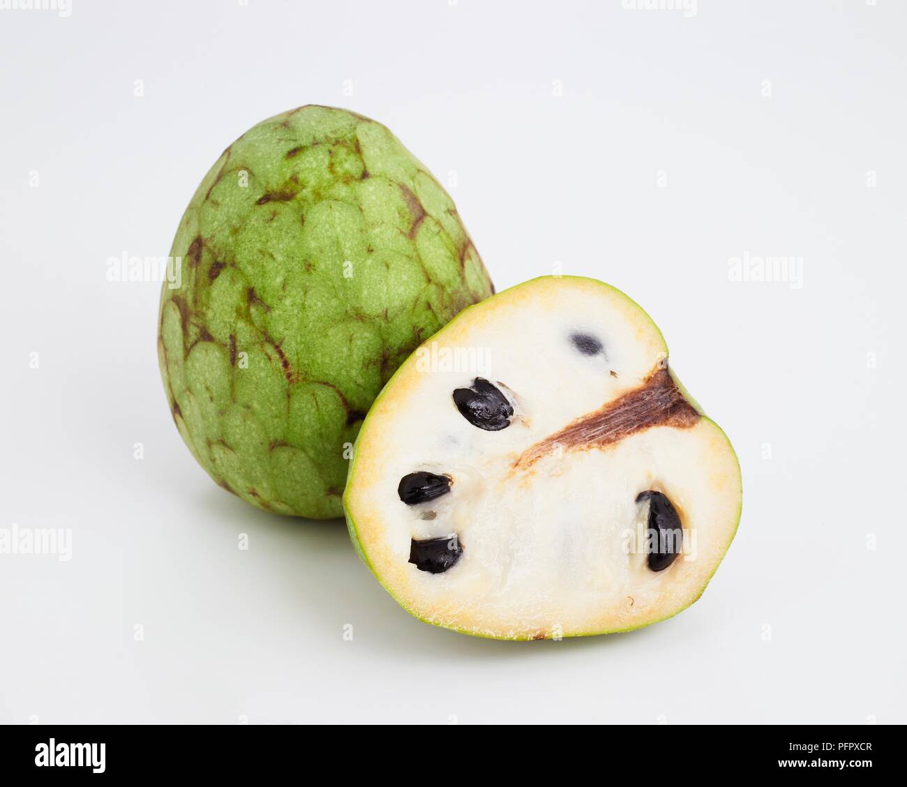 Cherimoya, whole and cut Stock Photo - Alamy