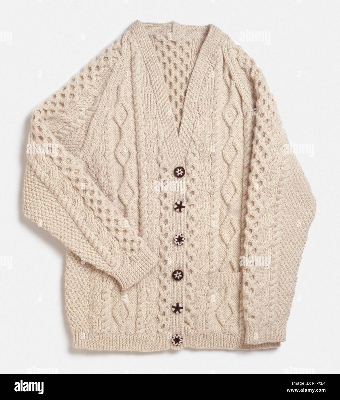Traditional white wool cardigan with ornate buttons Stock Photo - Alamy