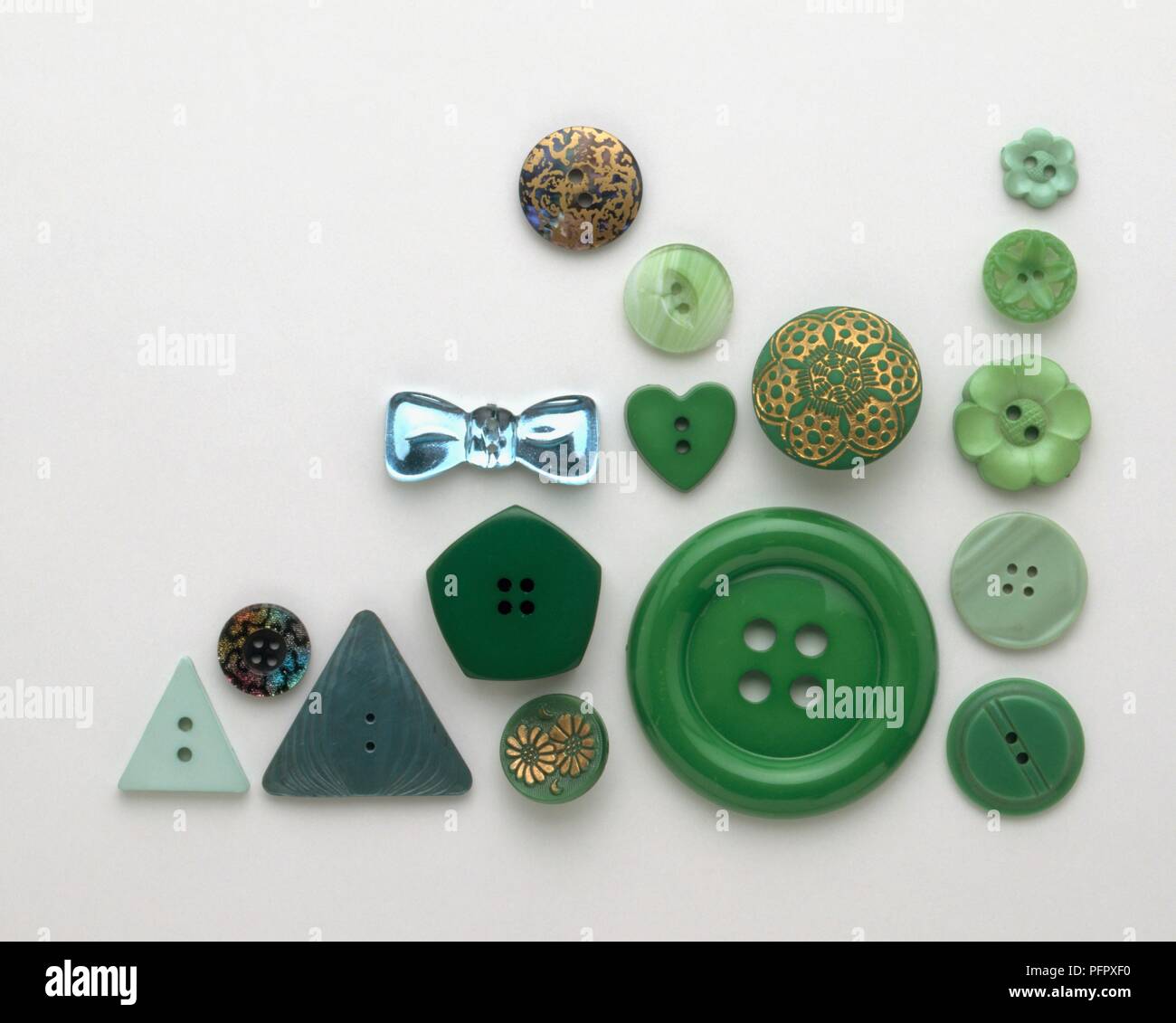 Ornate green buttons of various shapes and sizes Stock Photo - Alamy