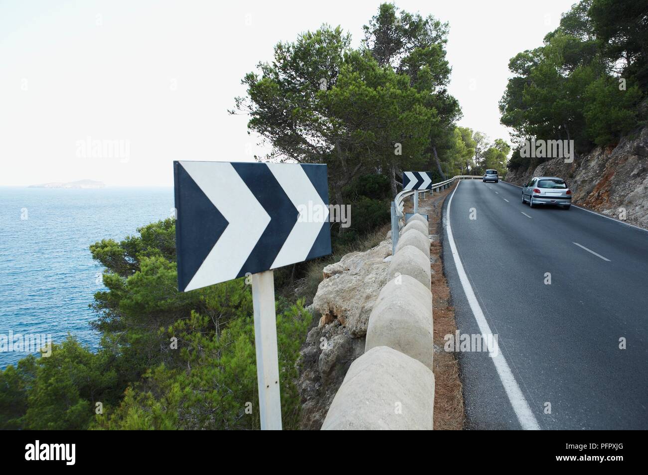 Spain, Ibiza, cars on coastal road Stock Photo - Alamy