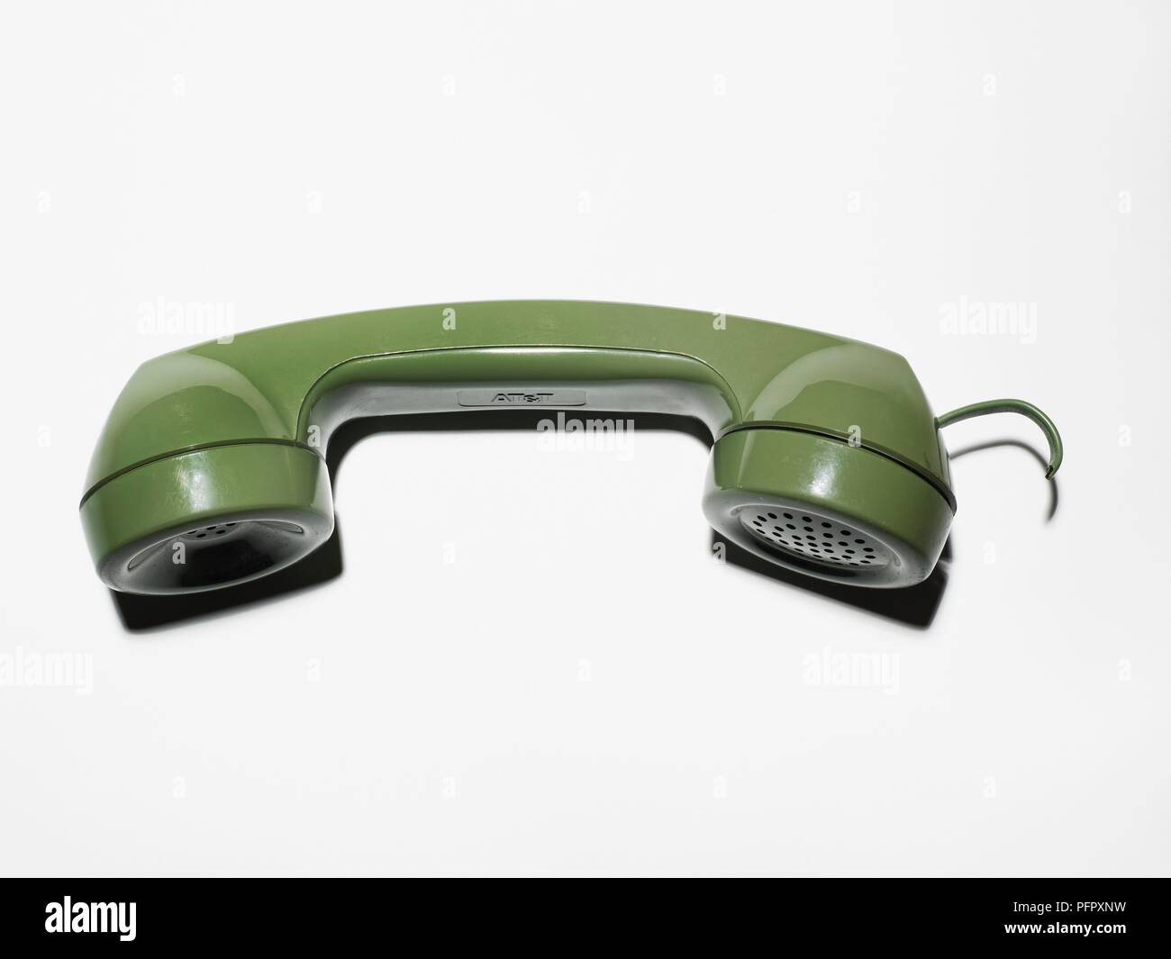 Old fashioned green telephone receiver Stock Photo - Alamy