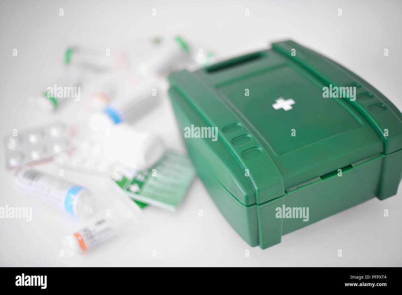 First aid kit next to various medications Stock Photo - Alamy