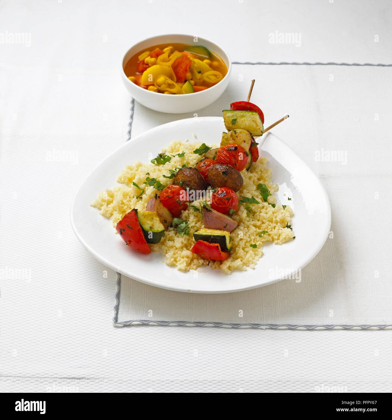 Vegetable kebabs with couscous, served with a mixed vegetable relish ...