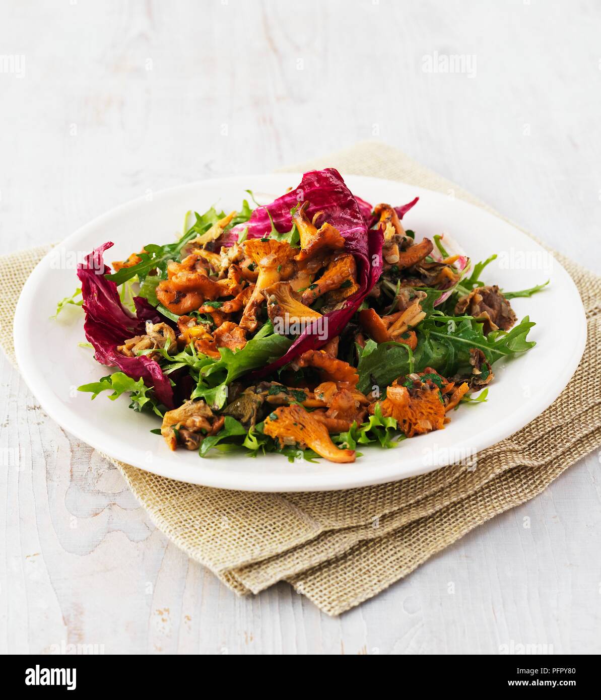Chanterelle mushroom, rocket and radicchio salad Stock Photo - Alamy