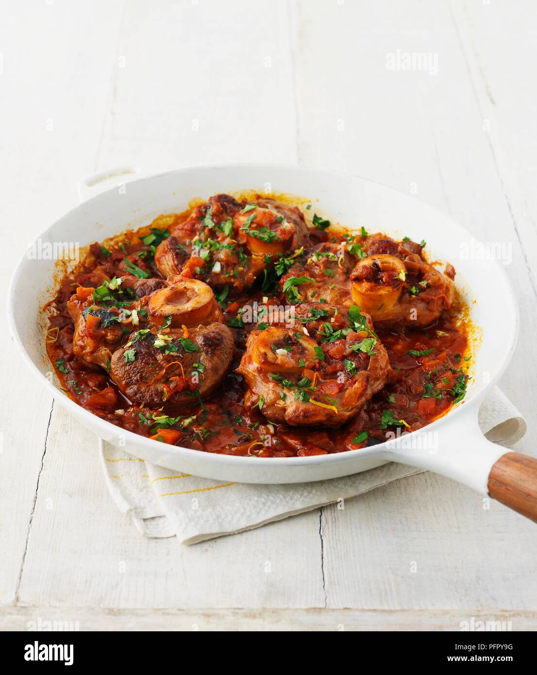 Ossobuco, braised, Milanese veal shanks with herbs and tomato sauce ...