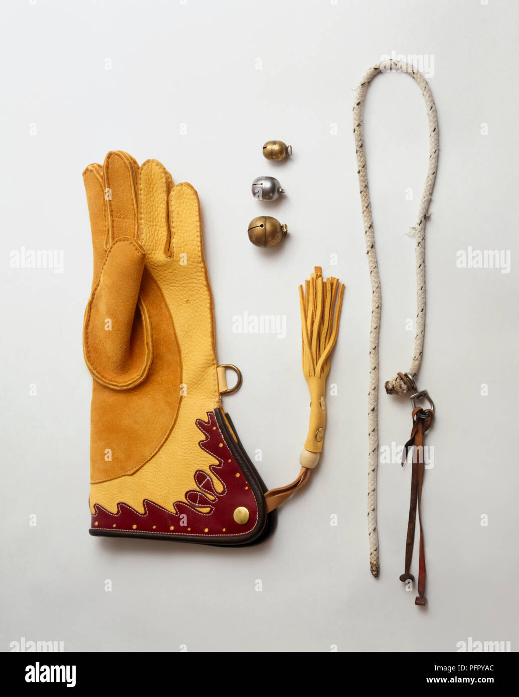 Falconry gauntlet, bells, leash and swivel Stock Photo - Alamy