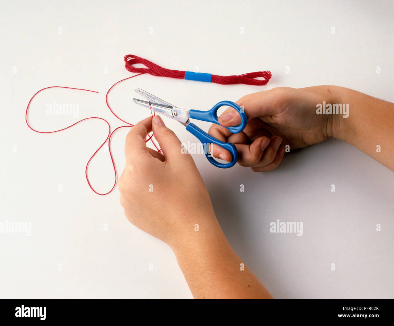 Hand holding pair scissors hi-res stock photography and images - Alamy