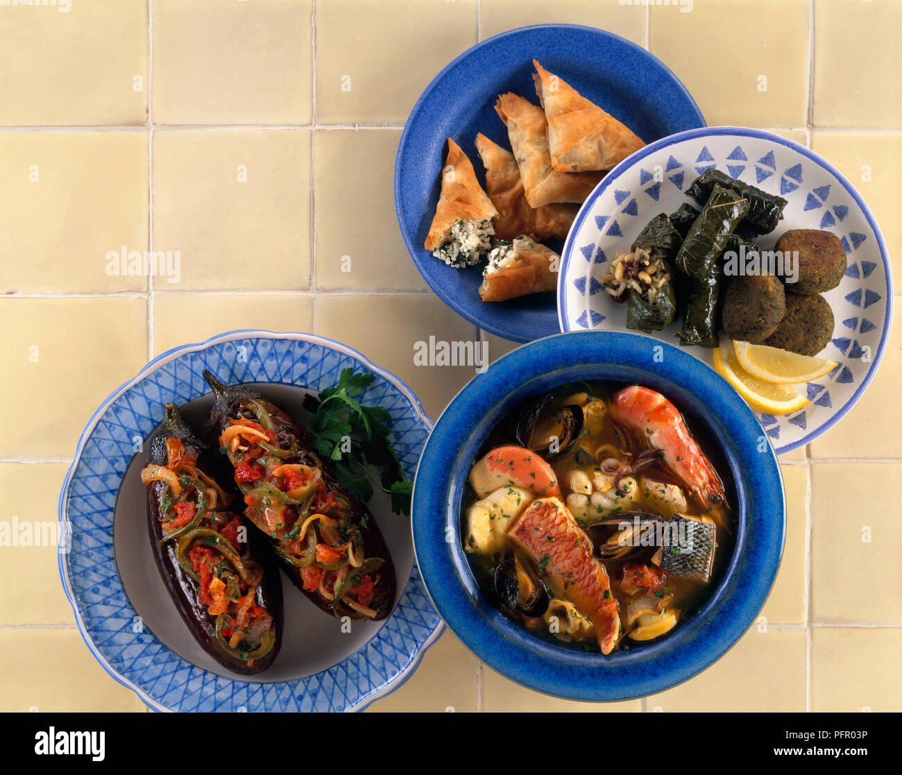 Stuffed filo pastry triangles, felafel and stuffed vine leaves with ...