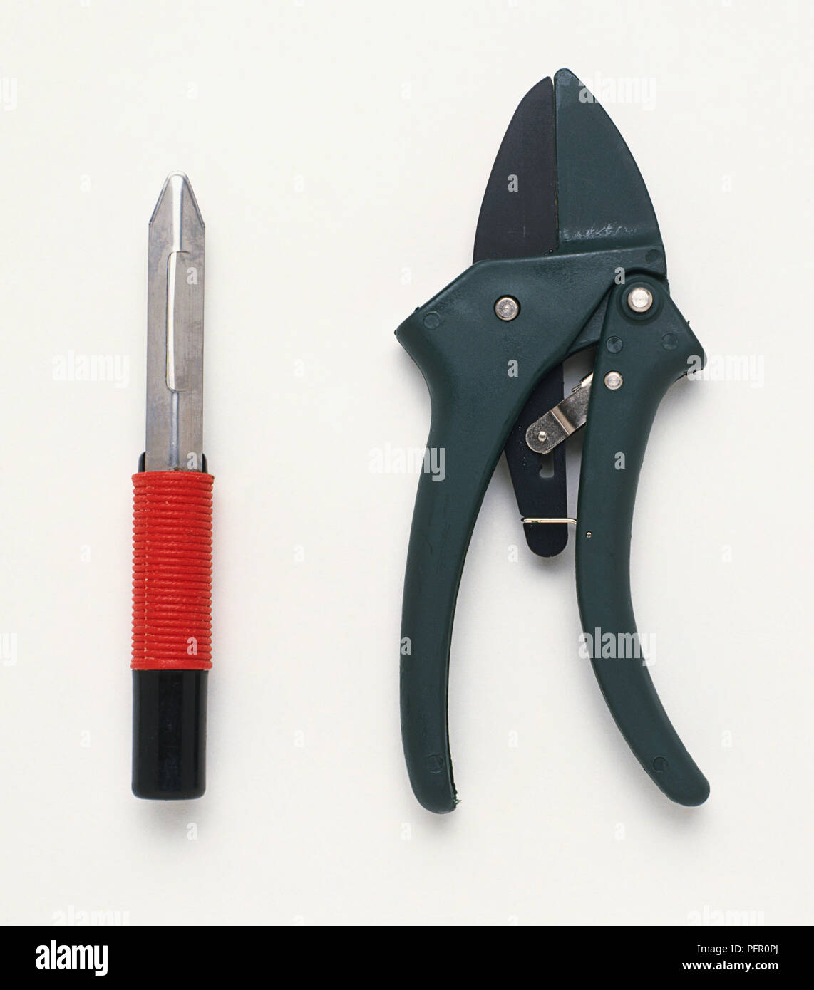 Secateurs and vegetable peeler Stock Photo - Alamy