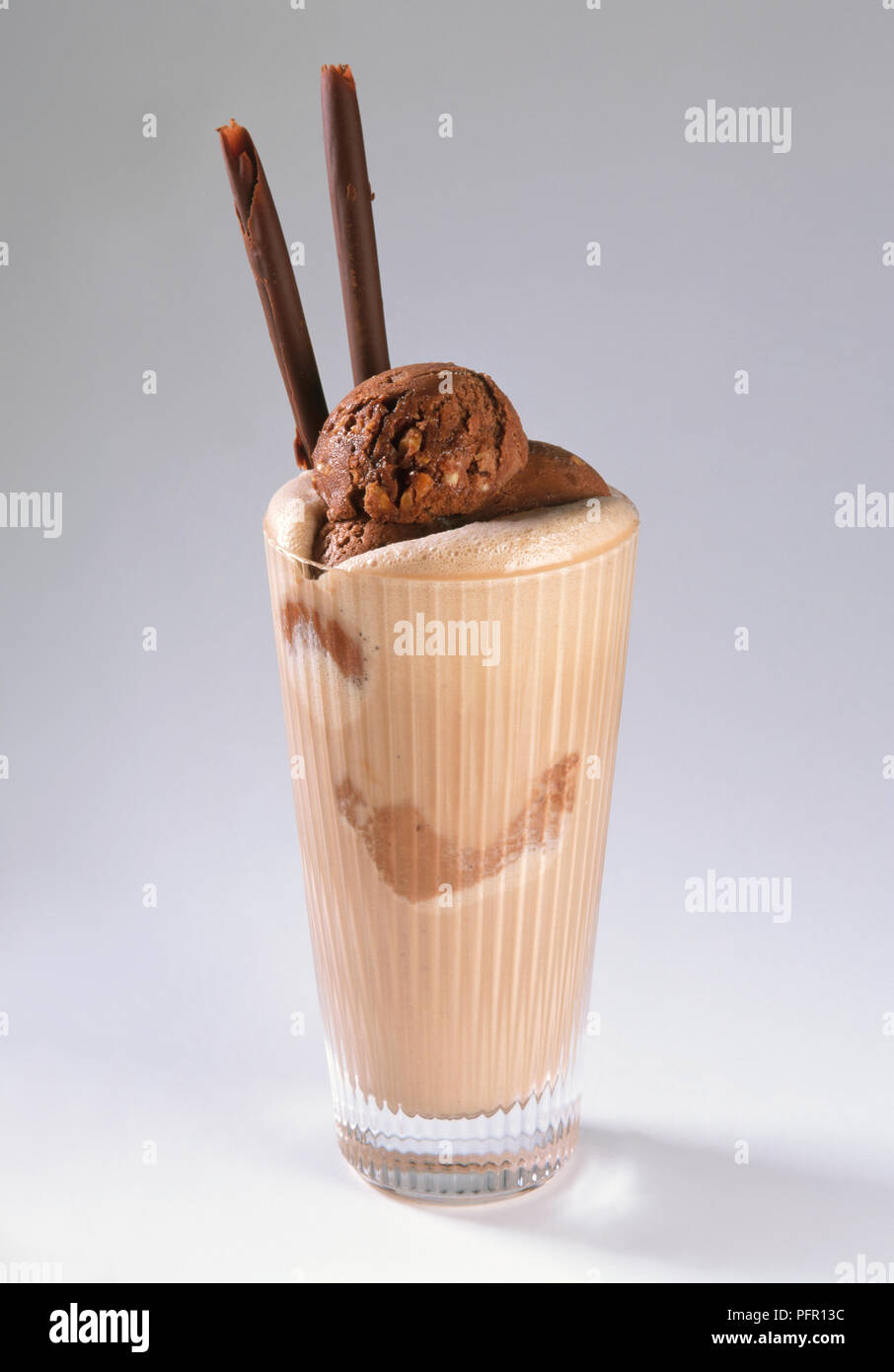 Chocolate float in tall glass topped with chocolate ice cream and curls ...