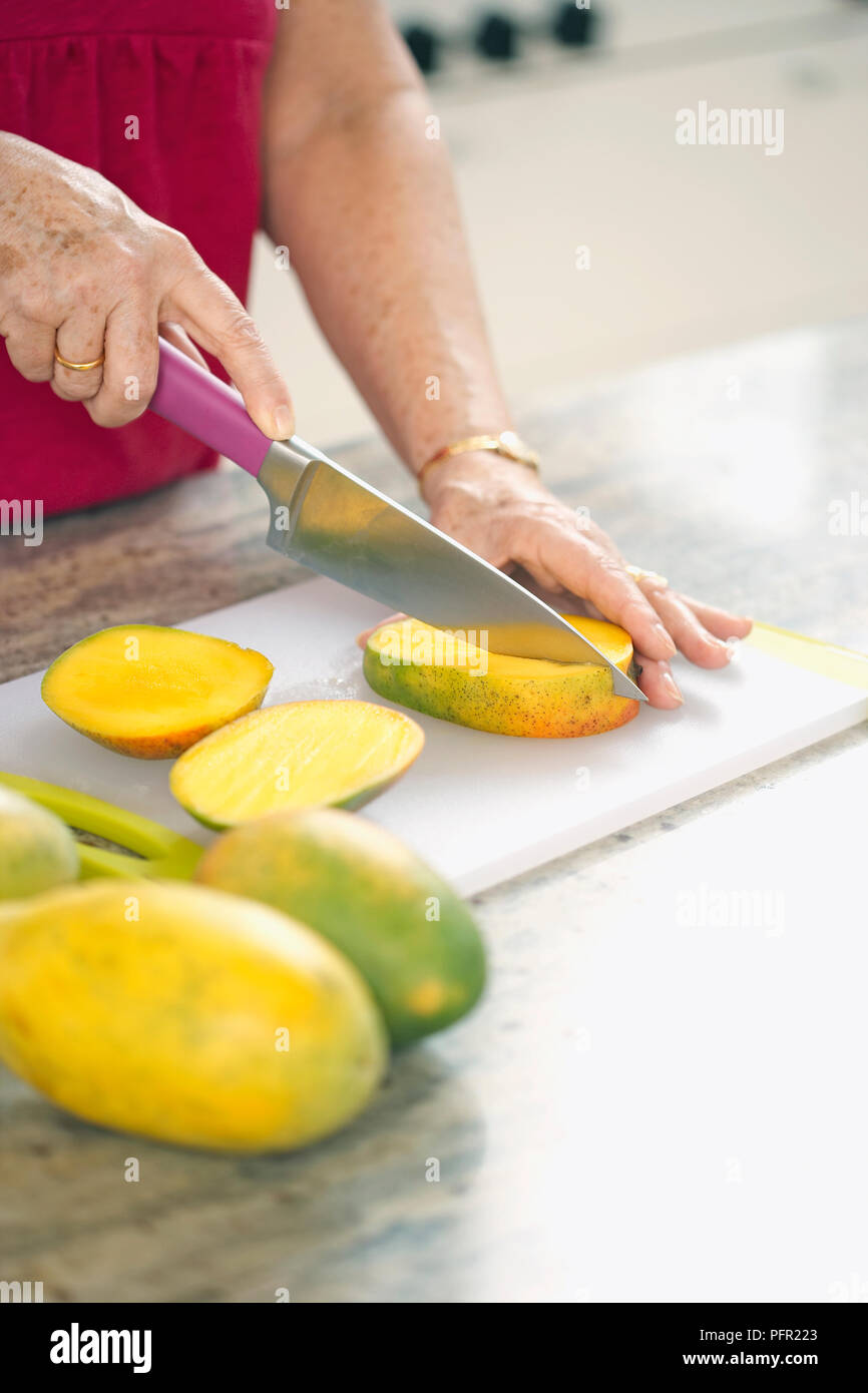 Mango fruit on chopping board hi-res stock photography and images - Alamy