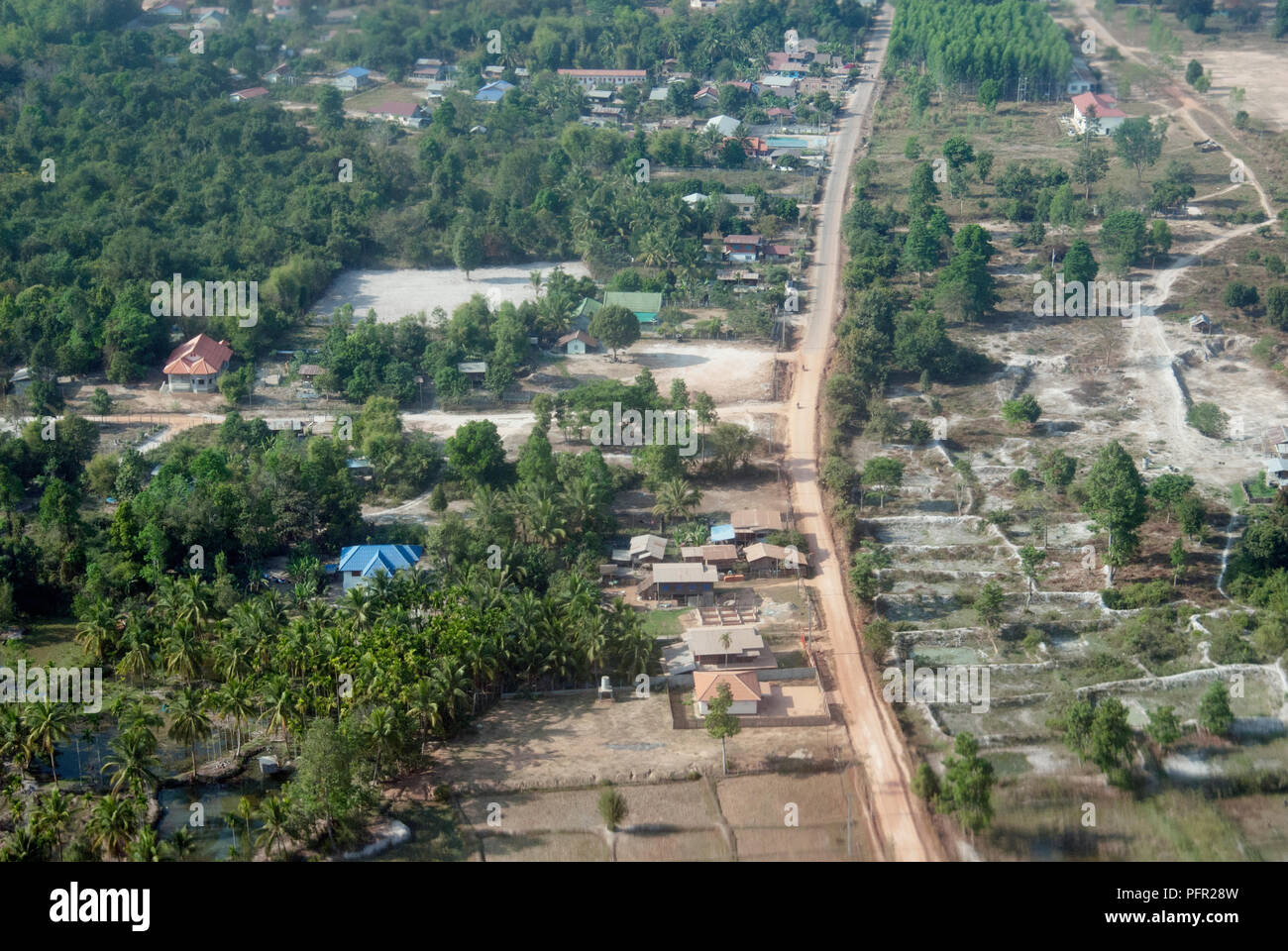 Laos, Southern Laos, aerial view of Savannakhet with trees and ...