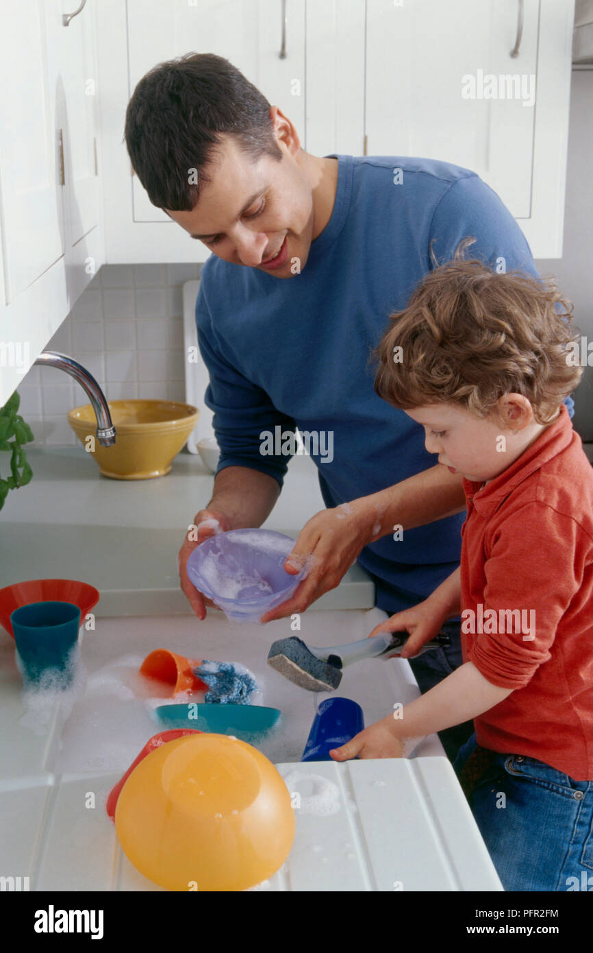 Boy doing the dishes hi-res stock photography and images - Alamy