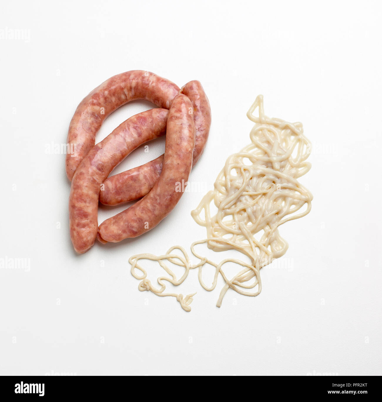 String of raw pork chipolata sausages and sheep casings Stock Photo - Alamy
