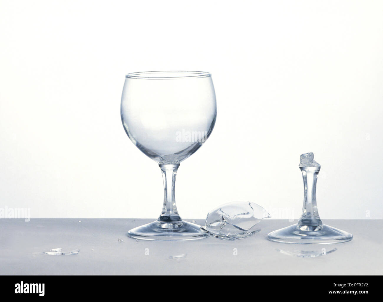 An intact wine glass next to a broken wine glass Stock Photo - Alamy