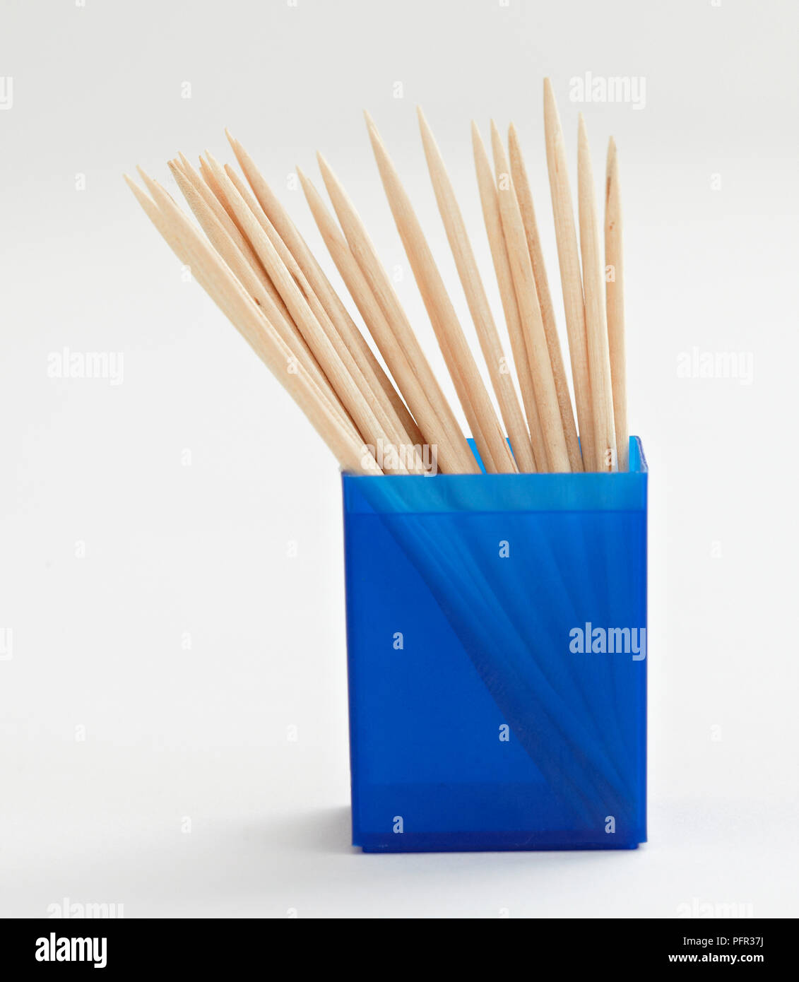 Cocktail sticks in blue holder Stock Photo - Alamy