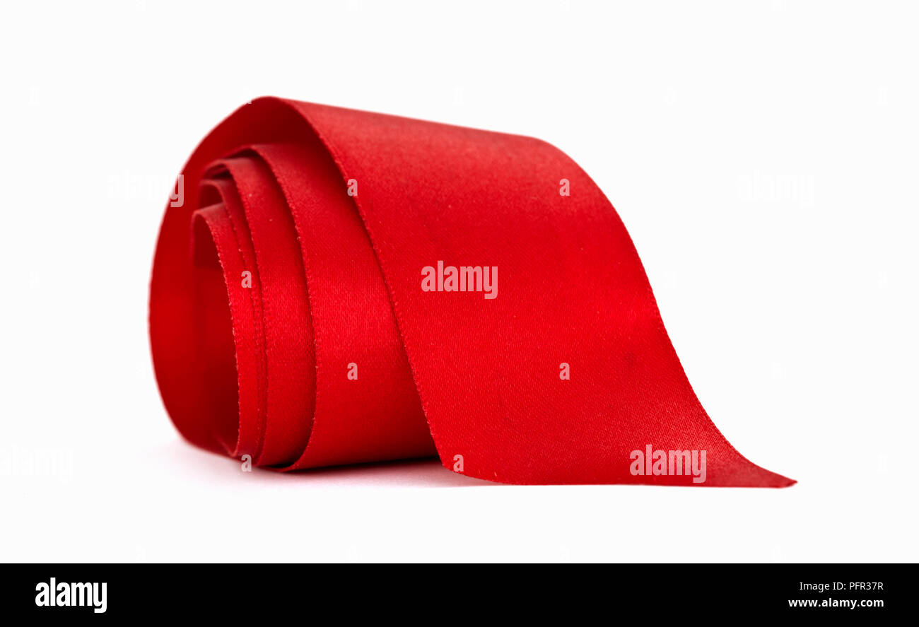Roll of red ribbon Stock Photo - Alamy