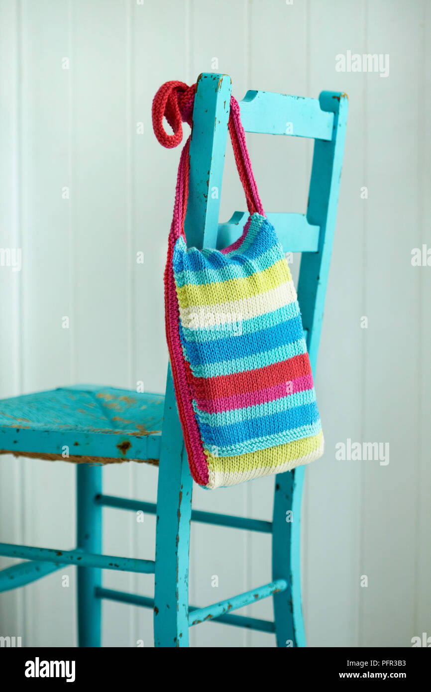 Bag hanging from chair hi-res stock photography and images - Alamy