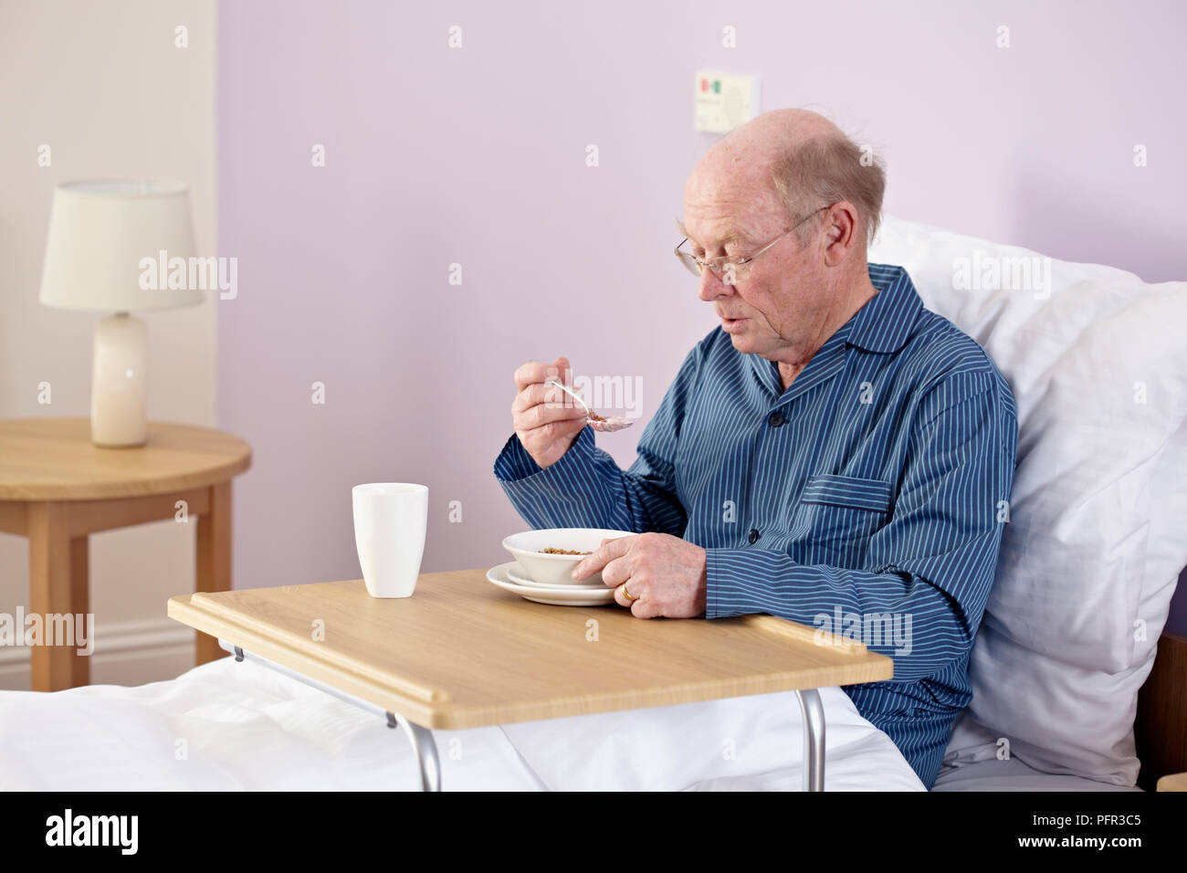 Man sitting at table hi-res stock photography and images - Alamy