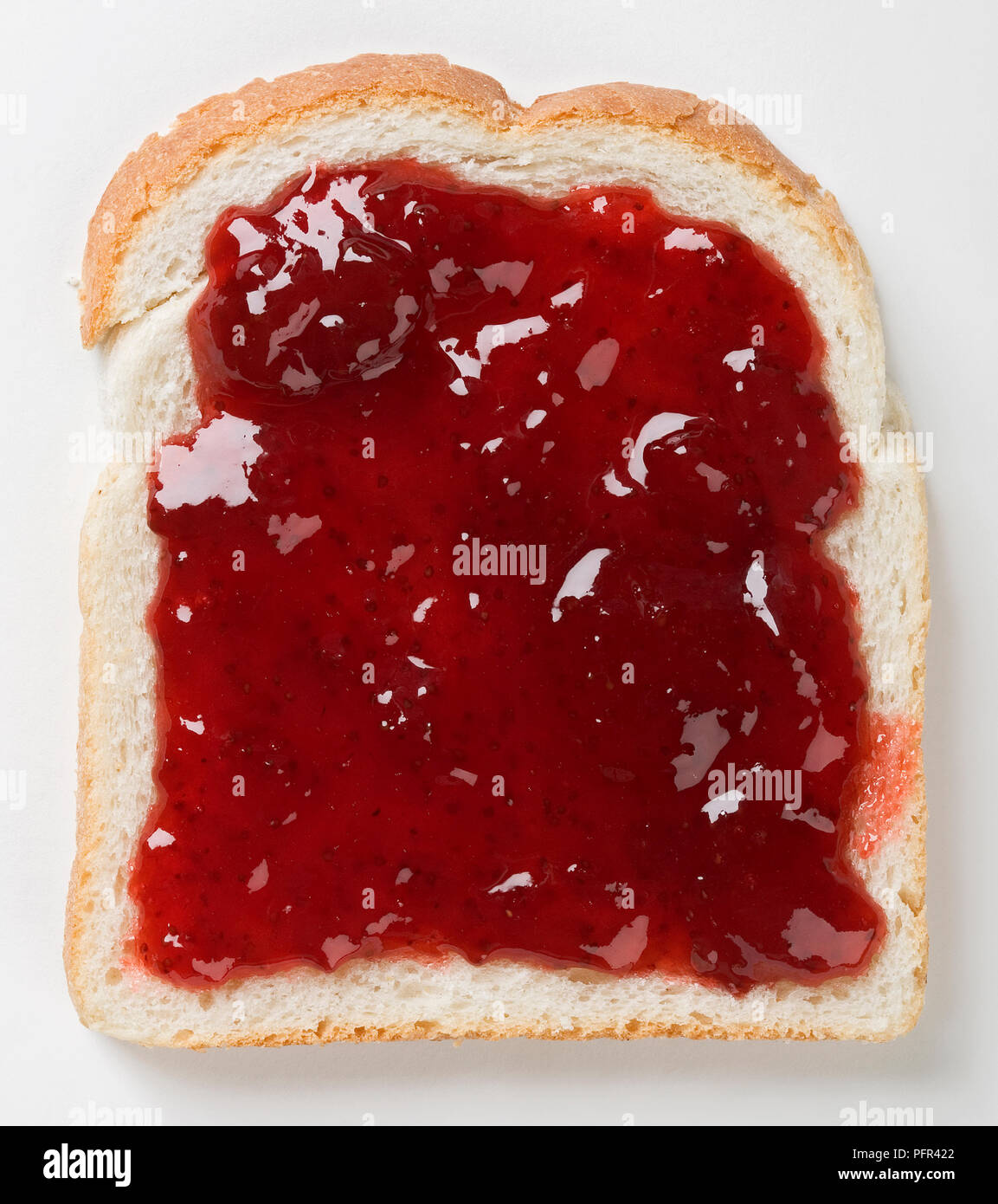 Strawberry jam on white bread Stock Photo - Alamy