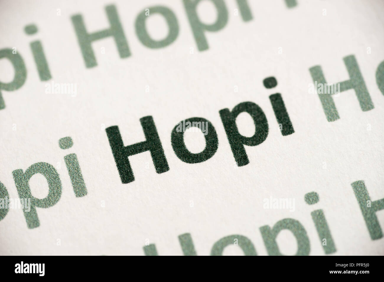 word Hopi language printed on white paper macro Stock Photo - Alamy