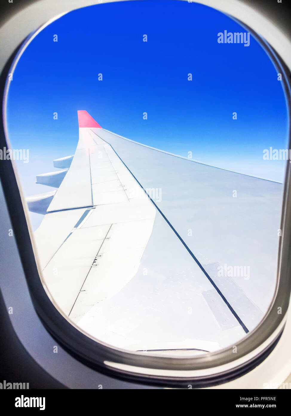 View of a commercial aeroplane from window where you can see the wing ...