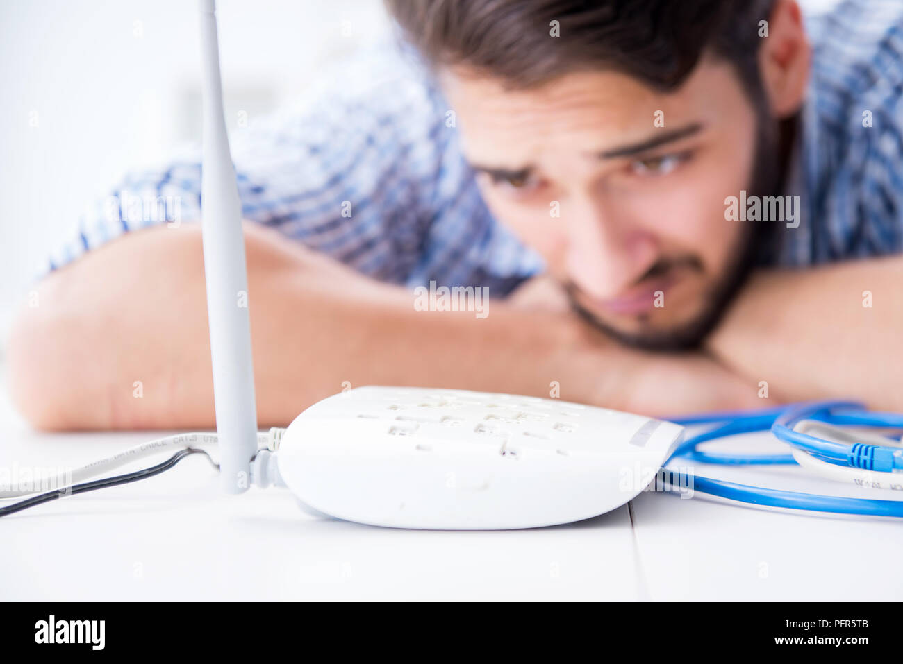 Frustrated young man due to weak internet reception Stock Photo - Alamy