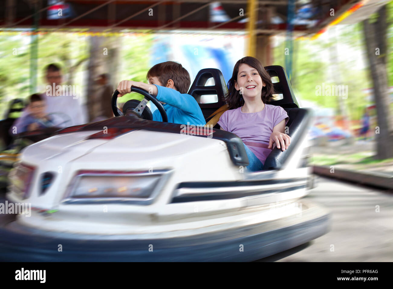 Children driving bumper cars hi-res stock photography and images - Alamy