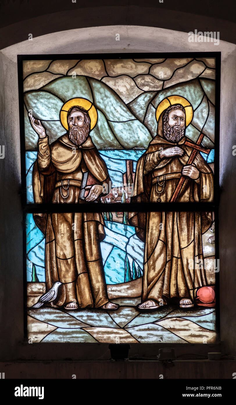 stained glass window in an italian church depicting two saints Stock ...