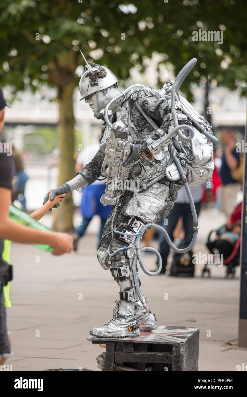A human statue on Londons, South Bank, UK Stock Photo - Alamy
