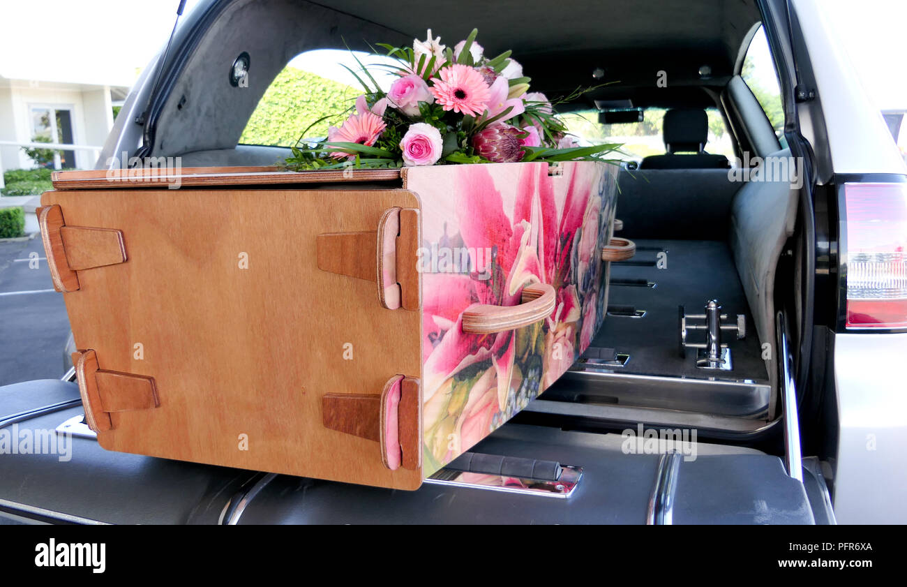 closeup shot of a funeral casket in a hearse or chapel or burial at ...
