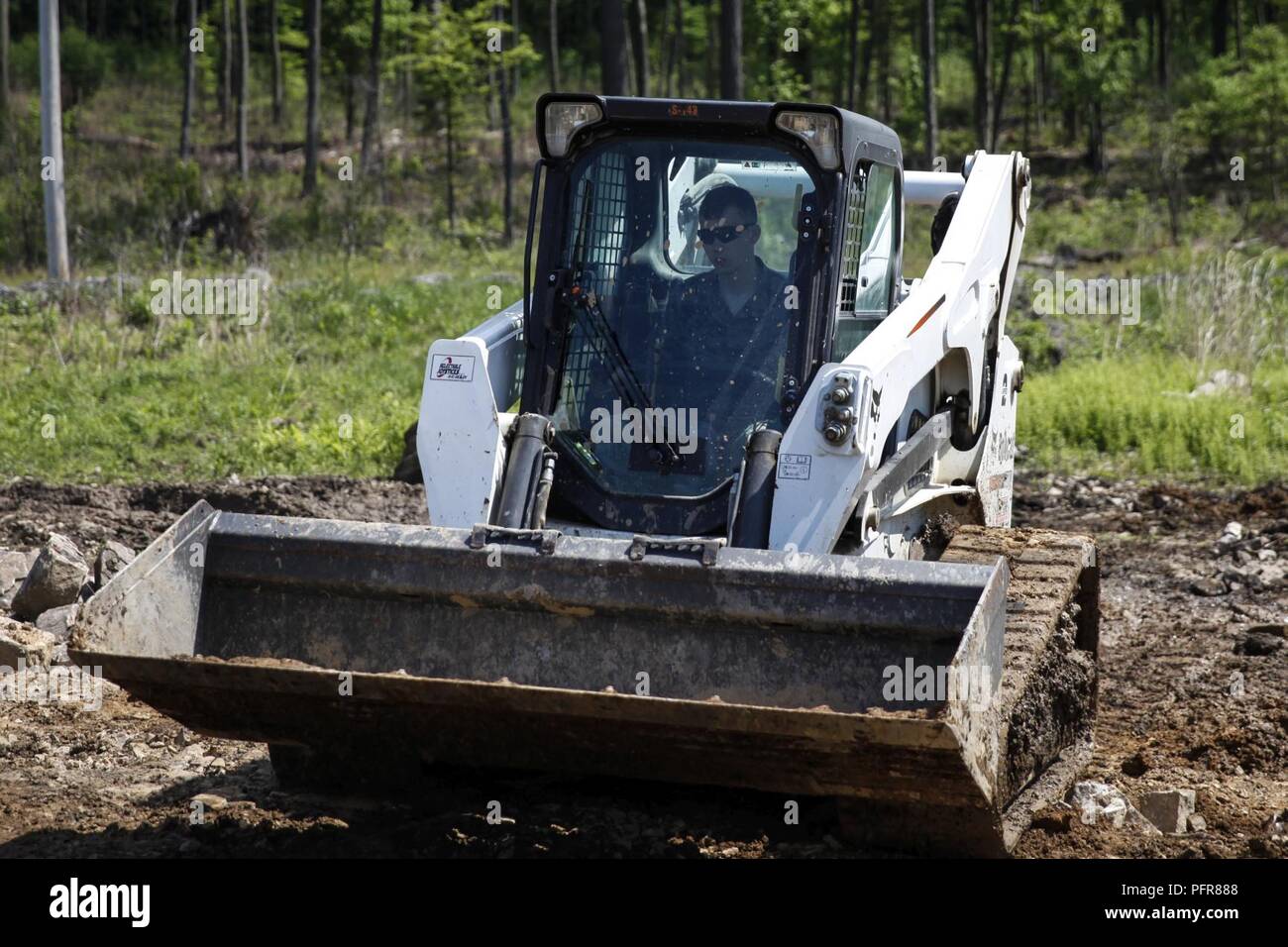U.S. Marine Lance Cpl. Mitchell R. Neimann, heavy equipment operator ...