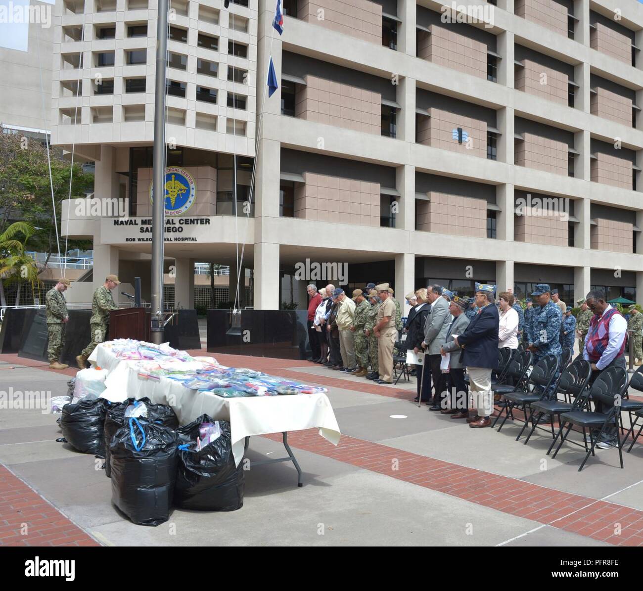 Leadership from Naval Medical Center San Diego (NMCSD) stand with ...