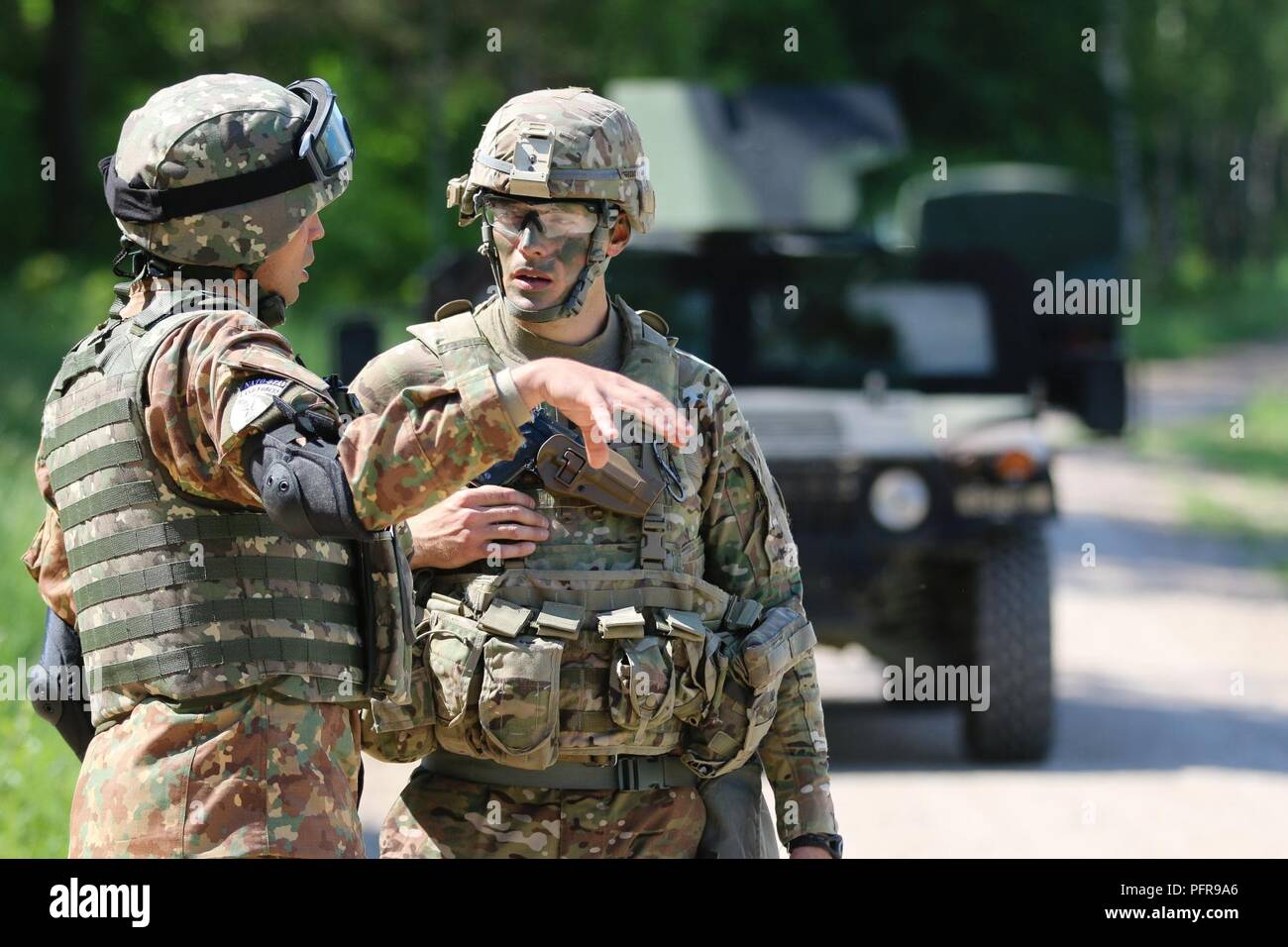 Romanian army Maj. Musat Octavian (left), Air Defense Artillery “Blue ...