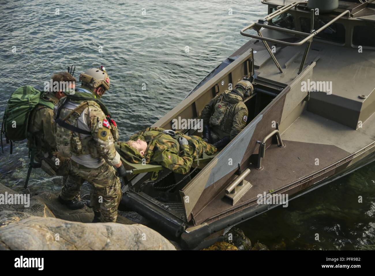 Norwegian Coastal Ranger Commandos (KJK) carry a simulated casualty on ...