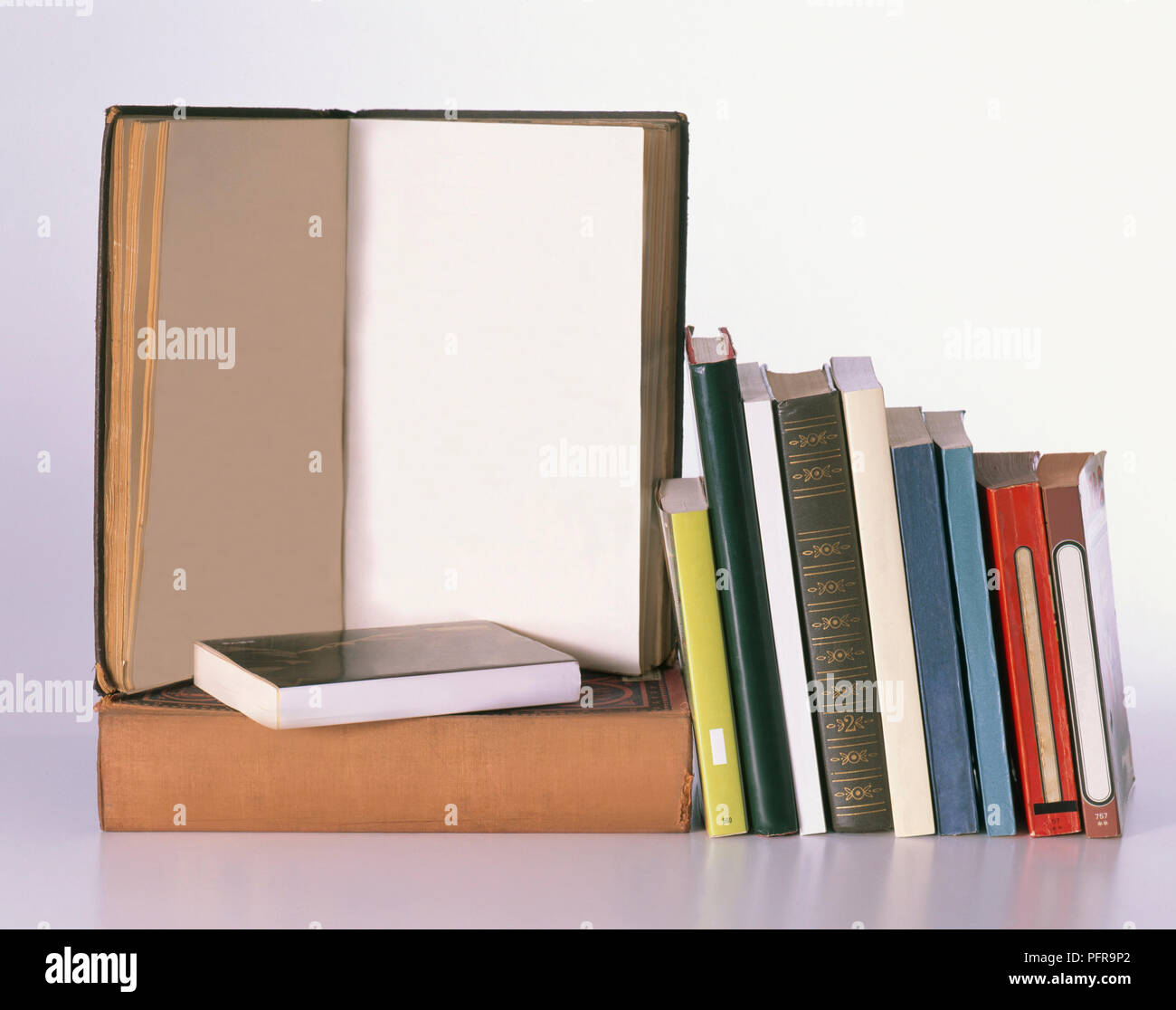 A group of books, one of them opened showing two blank pages Stock ...