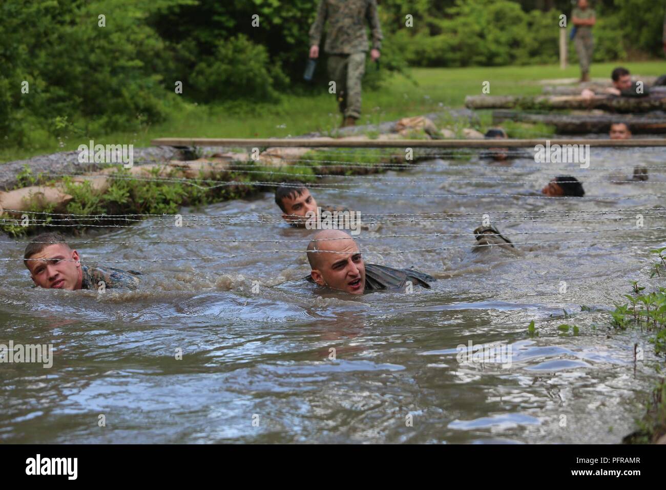 U.S. Marines with 2nd Marine Logistics Group swim through barbed-wire ...
